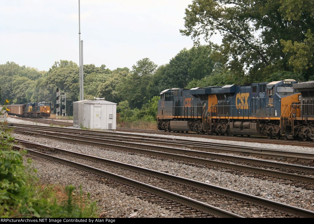 CSX 3179, 850, and 294 roll in while CSX 3021 and 510 roll out